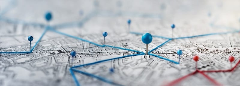 Find your way. Location marking with a pin on a map with routes ...